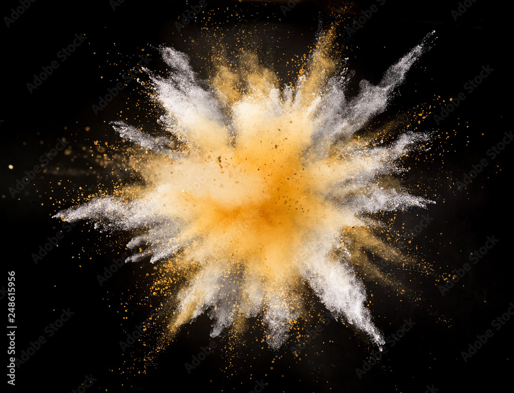 Silver and gold powder explosion on black background. Freeze motion ...