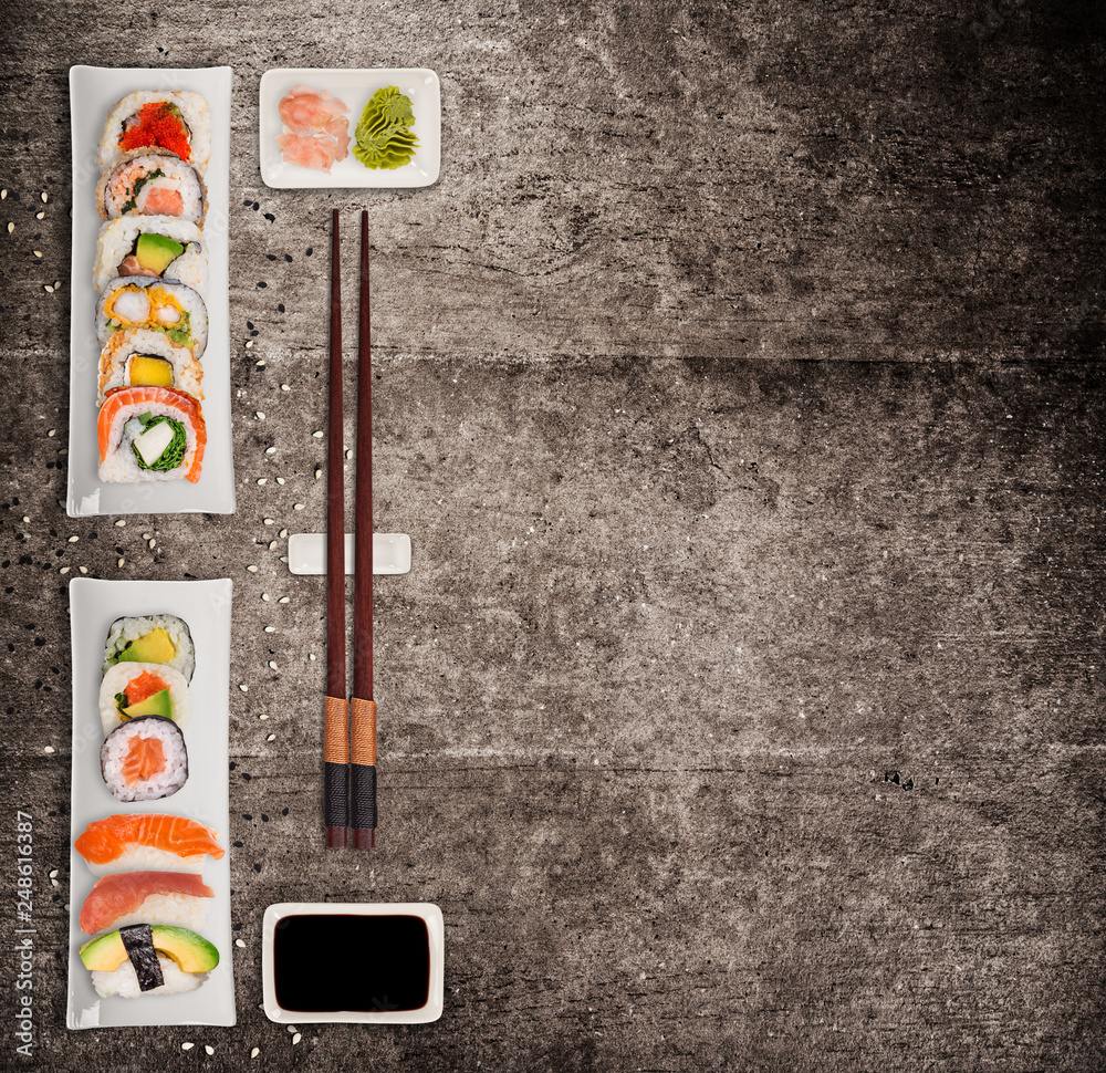 Traditional japanese sushi pieces on rustic concrete background, top ...