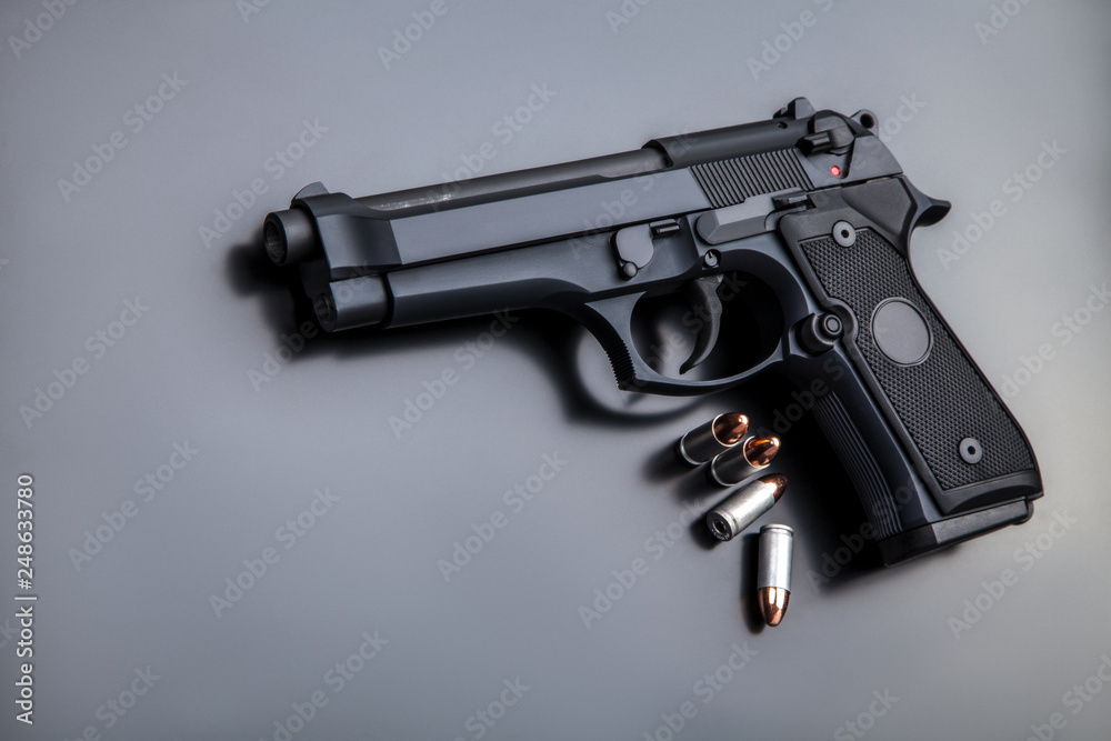 black modern gun on black background. 9mm pistol gun Stock Photo ...
