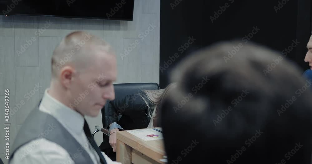 Beautiful boss sits with her mouth taped on a chair in the office. Chef ...