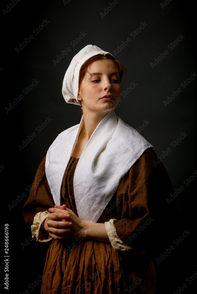 Medieval maid posing in studio Stock Photo | Adobe Stock