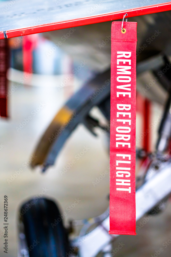 old remove before flight sign Stock Photo | Adobe Stock