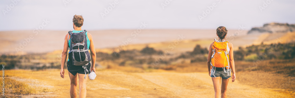 Hike hikers couple walking on nature landscape mountain background. Two ...