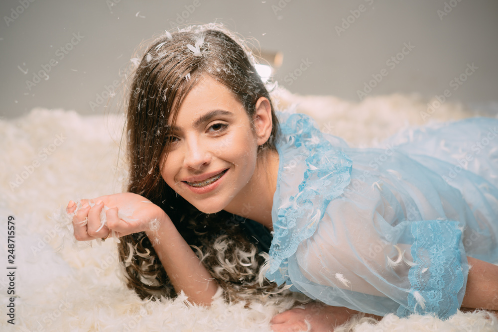 Feeling Lazy Pretty Girl In Nightie Lingerie With Feather In Long Hair