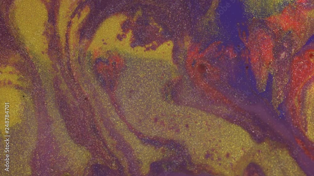 Purple gold yellow coral ink. Liquid sparkling paints moves and mixing ...