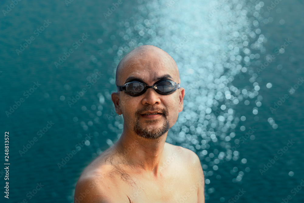 topless swimming bald beard man in black goggle portrait with white ...