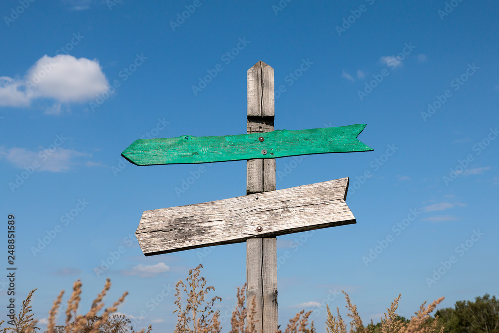old wooden signpost with two arrows with copy space Stock Photo | Adobe ...