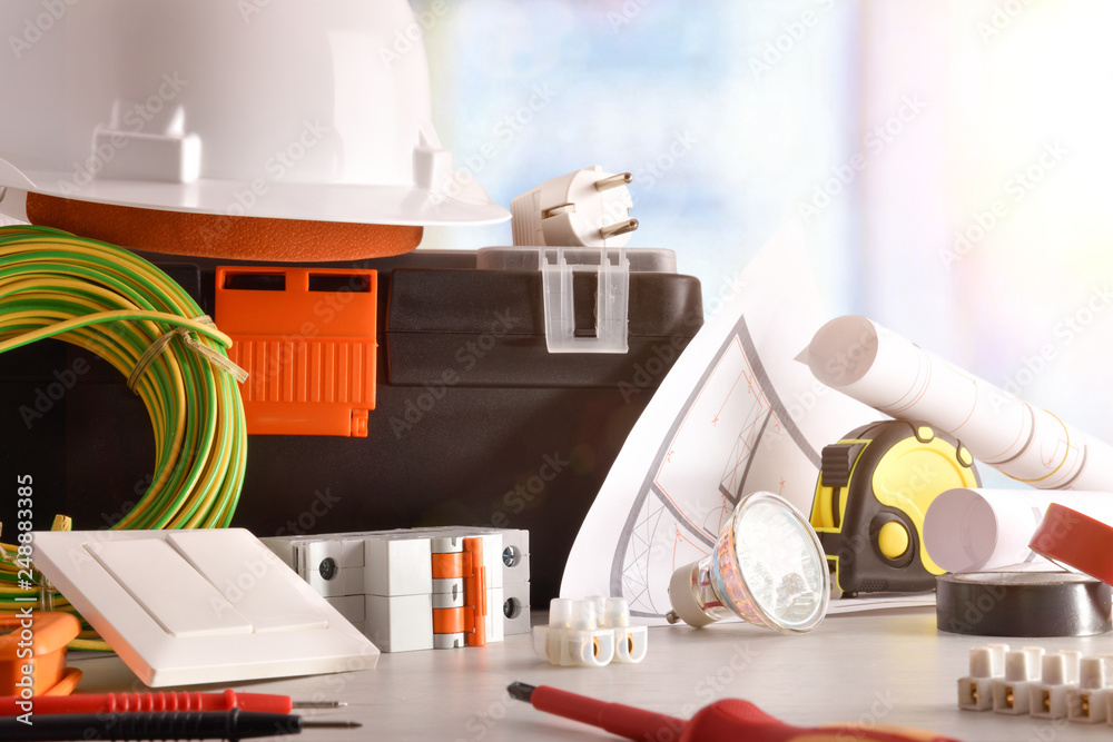 Electrician's office desk with electrical equipment window background ...