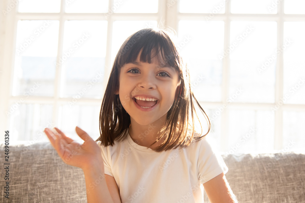 Happy cute little youtuber vlogger waving hand looking at camera Stock ...