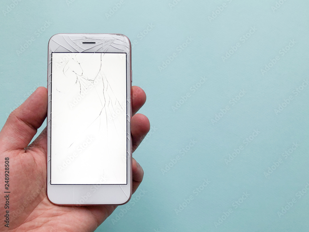 Male hands holding broken mobile smartphone after drop, copy space ...
