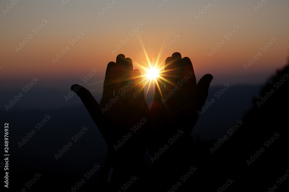 Faith of christian concept: Spiritual prayer hands over sun shine with ...