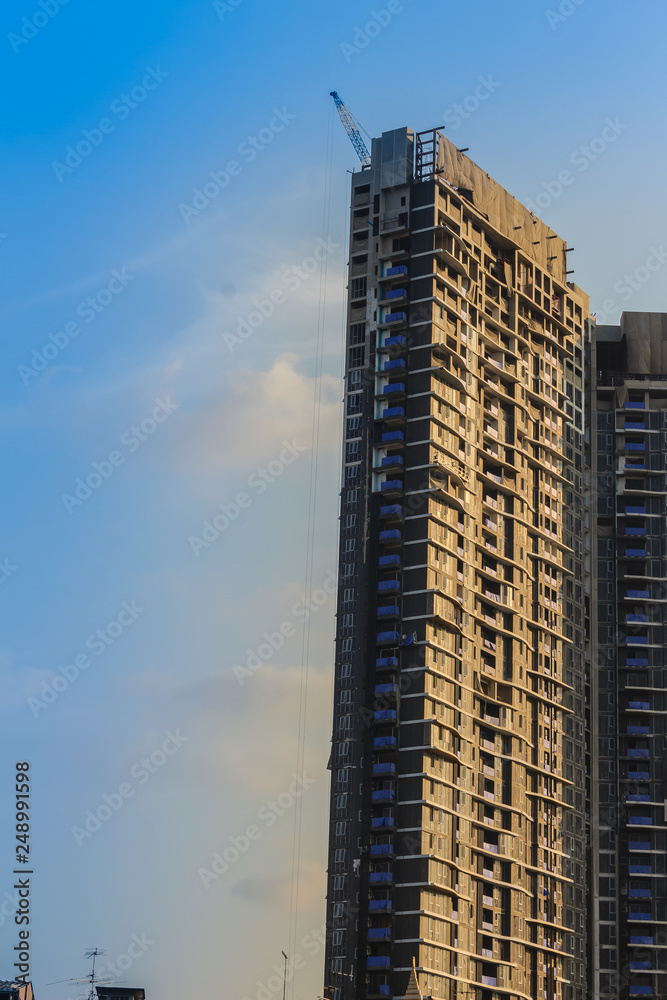 Large scale condominium construction site with the luffing jib tower ...