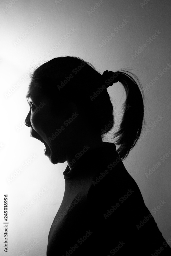 silhouette angry scary portrait of Asia long hair woman in black and ...
