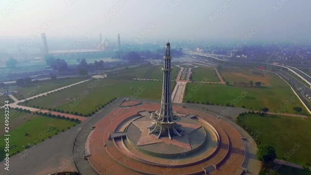 Aerial rotating view of Minar-e-Pakistan with city and Mughal`s Famous ...