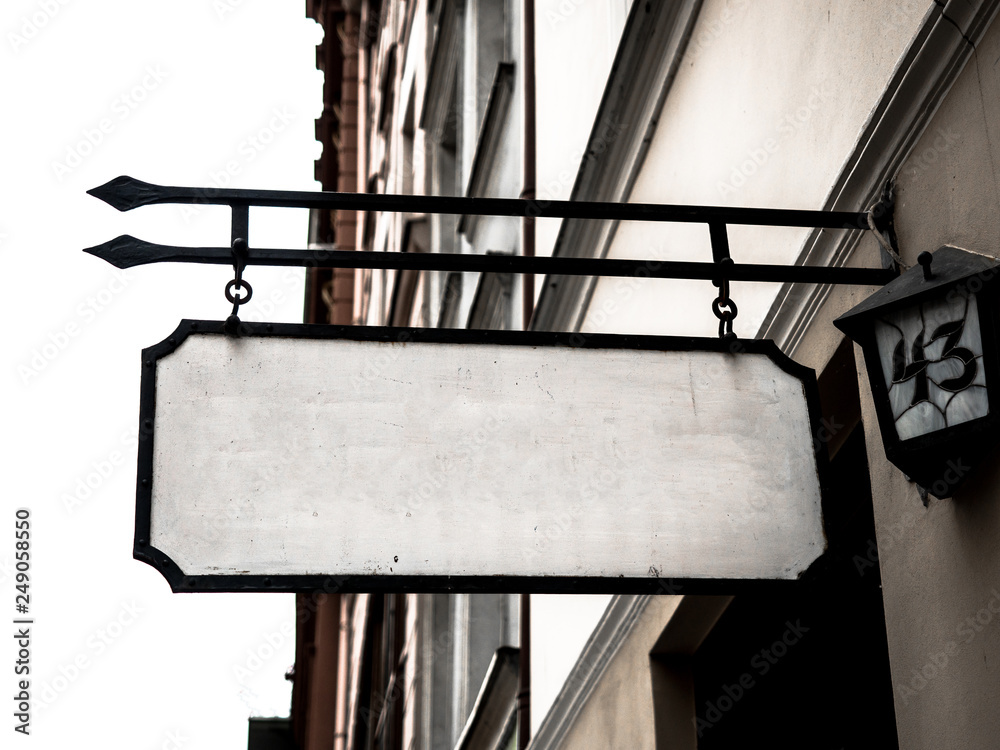 Signboard side view of empty white mock up, signage with old city wall ...