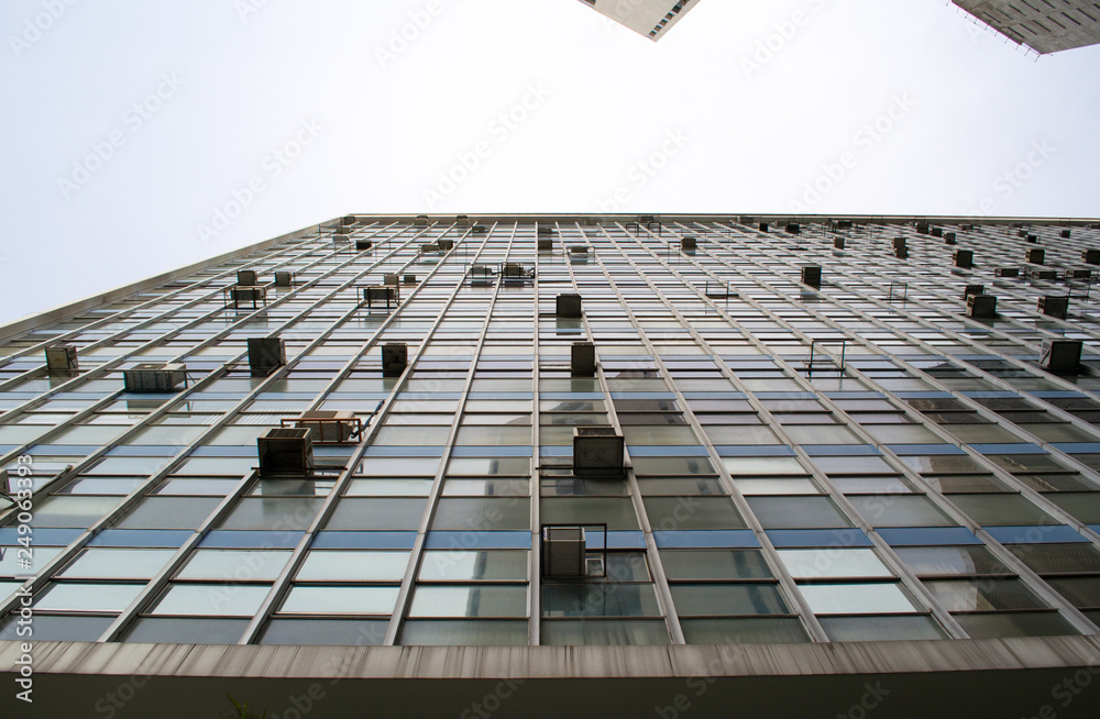 Interesting building glass facade with many external units of the air ...