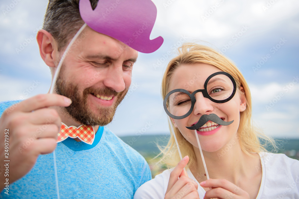 Humor and laugh concept. Couple posing with party props sky background ...