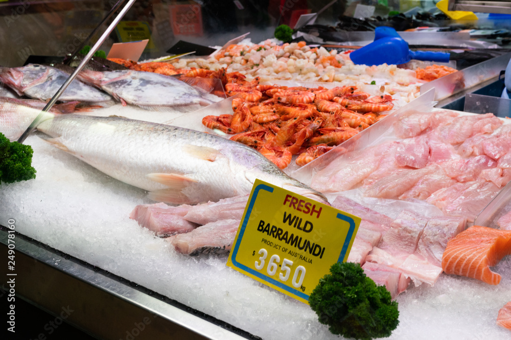 Fish stall with barramundi fish fillets in a market in Melbourne Vic ...