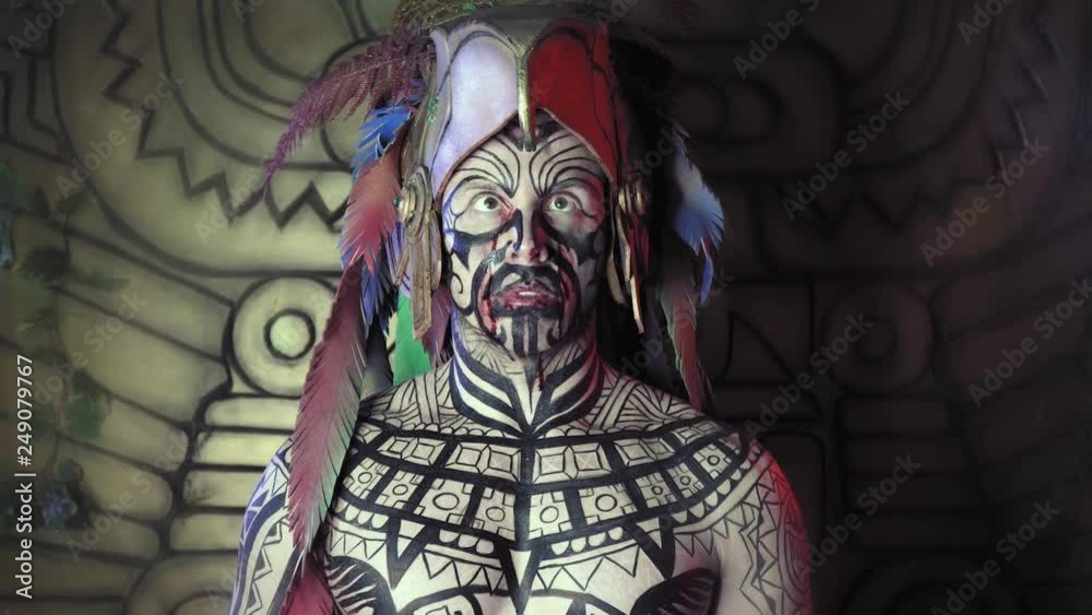 Ancient aztec warrior with beautiful war paint on his body, staring at ...