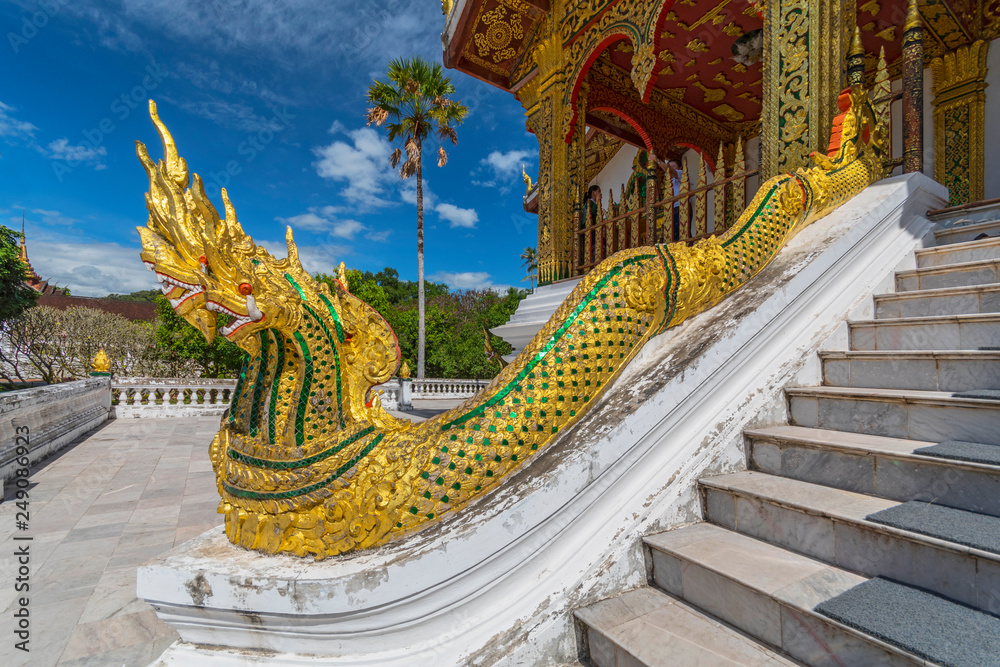 Golden naga (King Cobras) decorate teh stairs of Haw Pha Bang (or ...