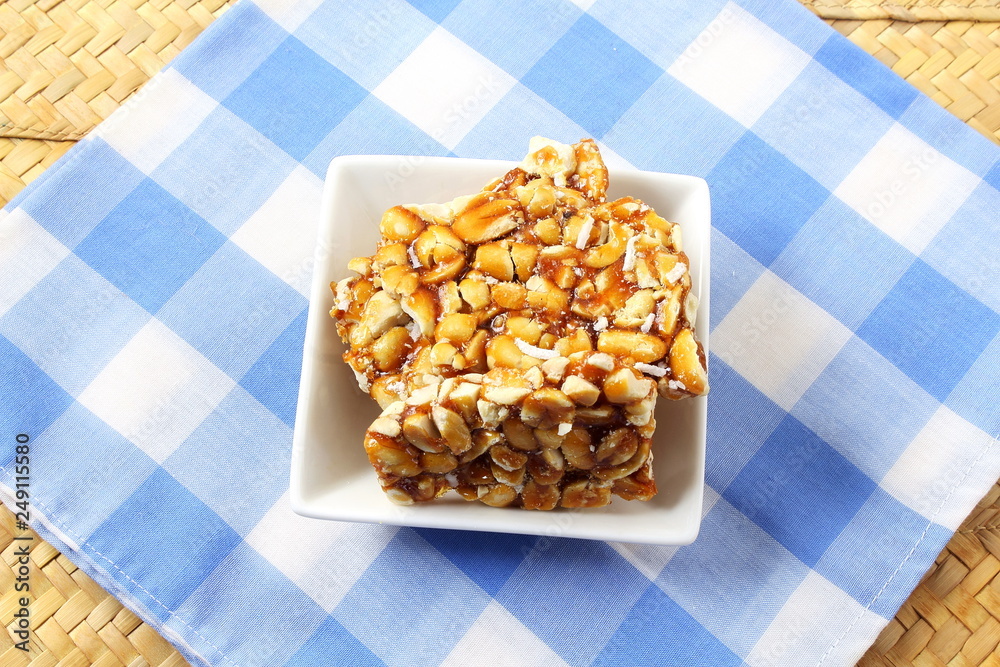 homemade traditional indian sweet chikki or peanut candy bar made with ...