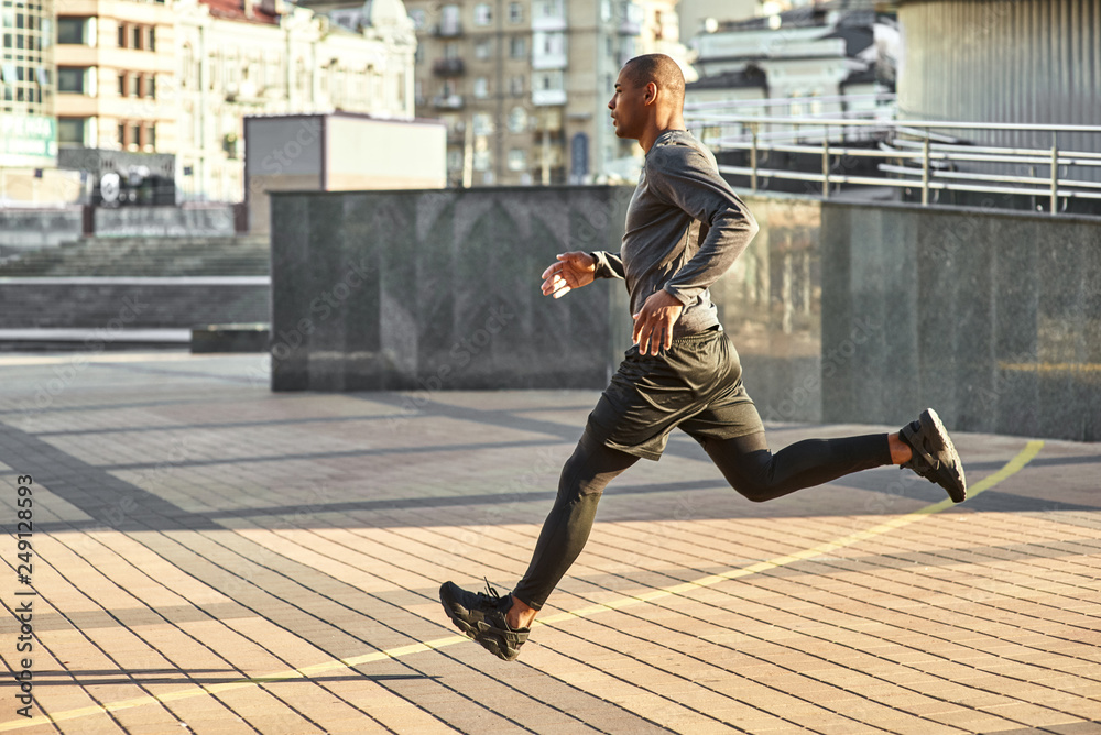 Full of energy! Full length portrait of athletic african man running ...