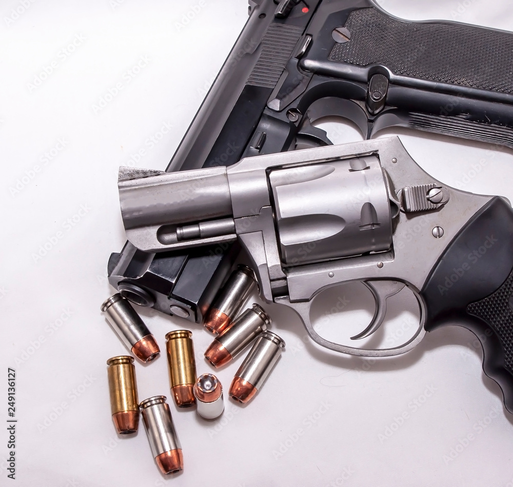 Two handguns, a 40 caliber pistol and a 357 magnum revolver with 40 ...
