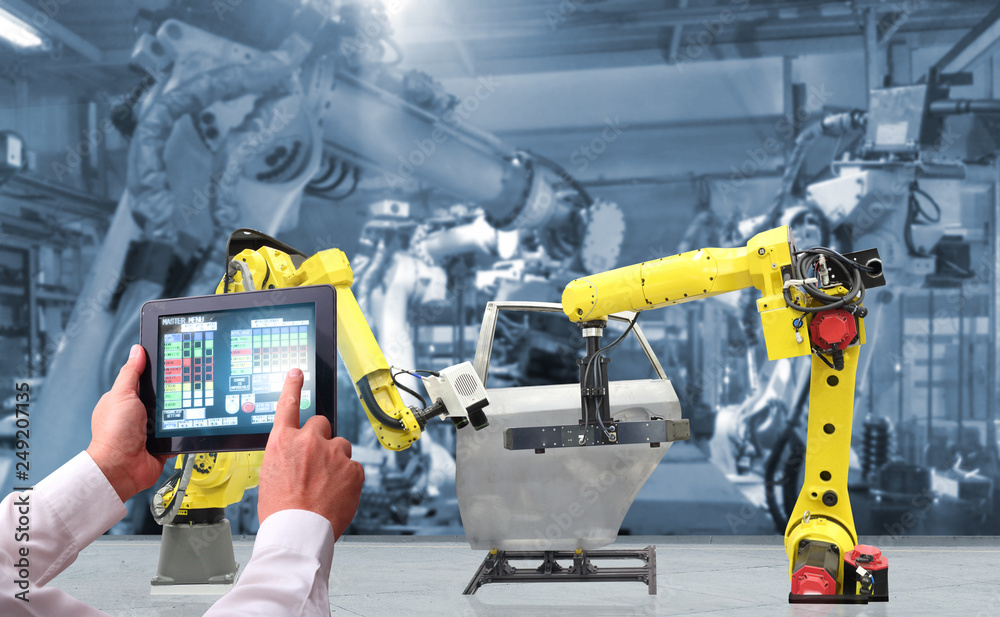 Man hand holding mobile phone or tablet with automate wireless Robot ...