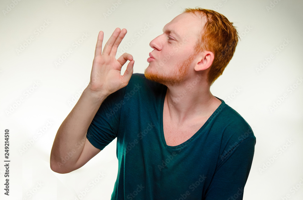 playful, cheerful, red haired man show gesture perfecto. caucasian male ...