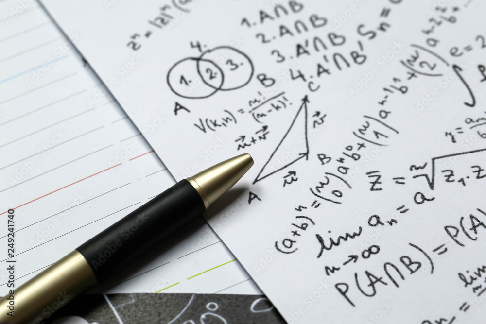 Foto de Math problems on graph paper with pencil ,formula arithmetic ...