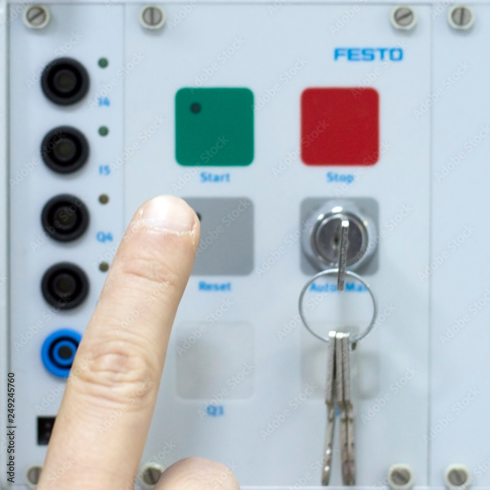 Male Hand Pushing Stop and Reset Buttons of Control Panel for ...