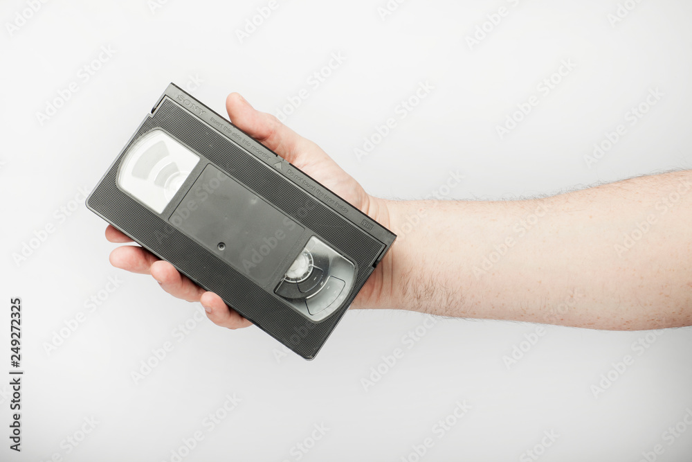 Male hand holds VHS, video tape Stock Photo | Adobe Stock
