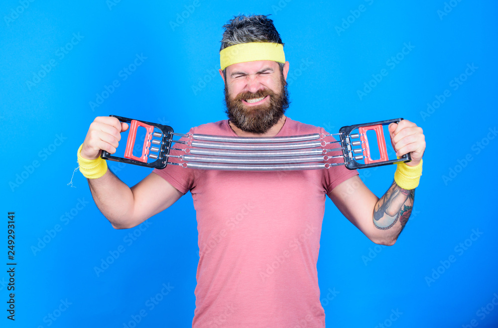 Try stretching exercise. Athlete workout with expander. Improve your ...