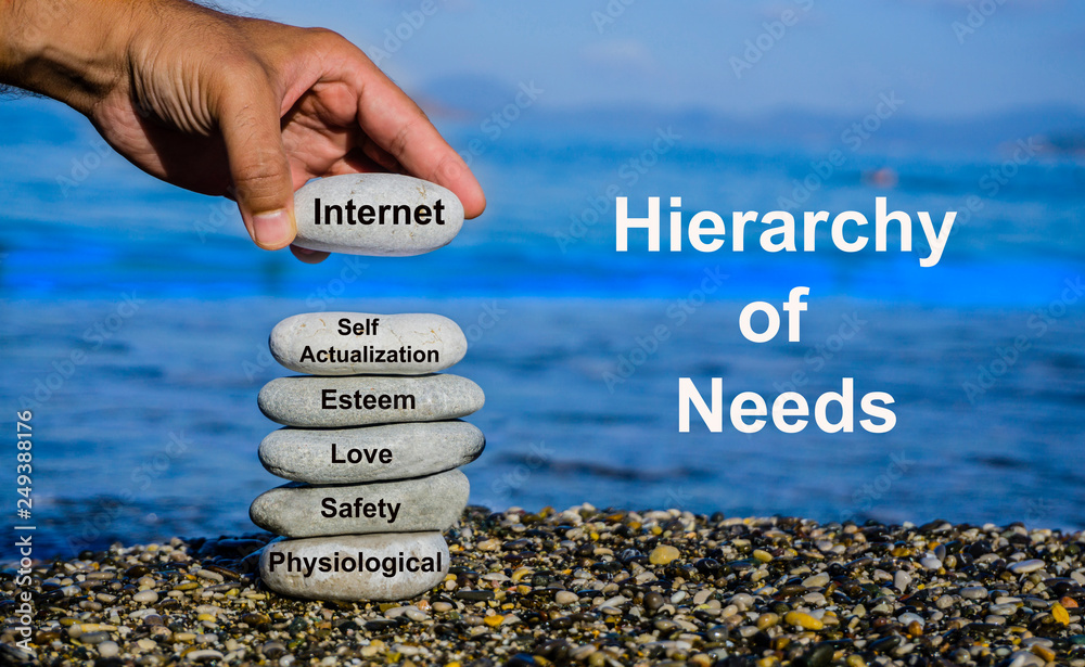 Wi-fi and internet addiction concept. Man adding stone to pebble tower ...