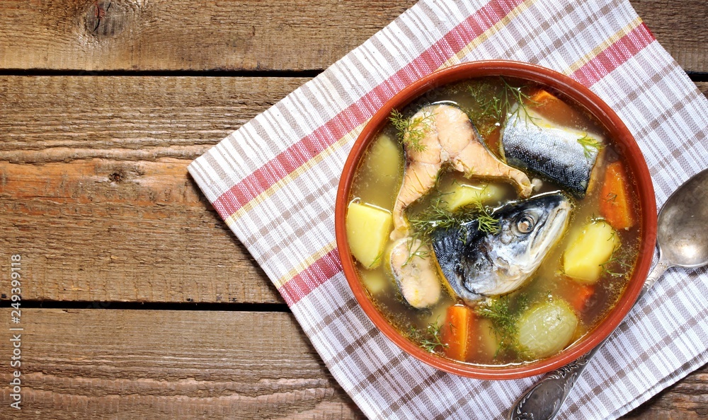 salmon fish soup with fish head. rustic style food. loaches malma and ...