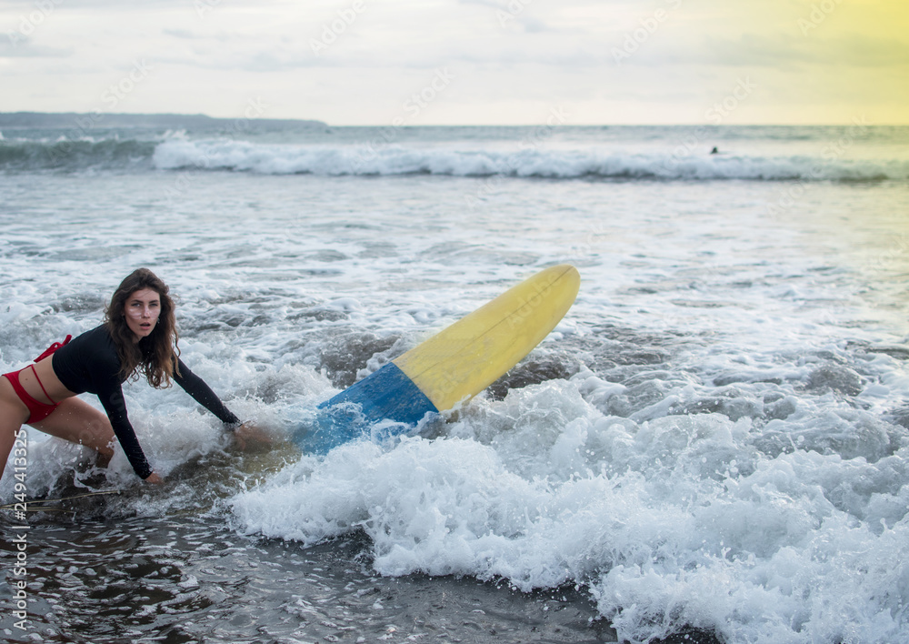 Young girl in bikini - surfer with surf board dive underwater with fun ...