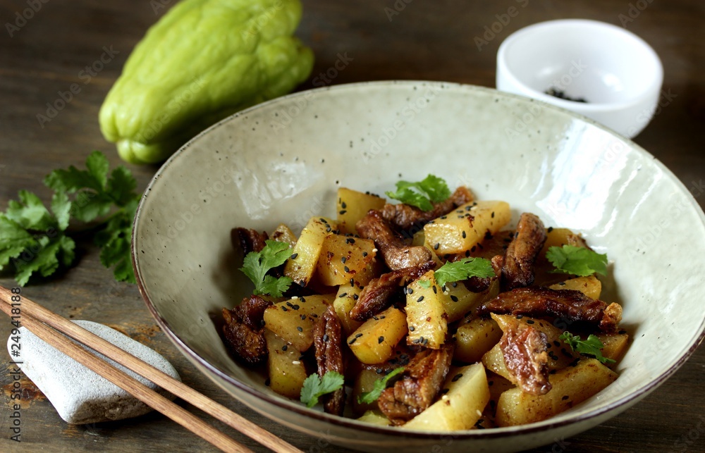 chayote with beef and sesame in asian style. The dish is popular in ...