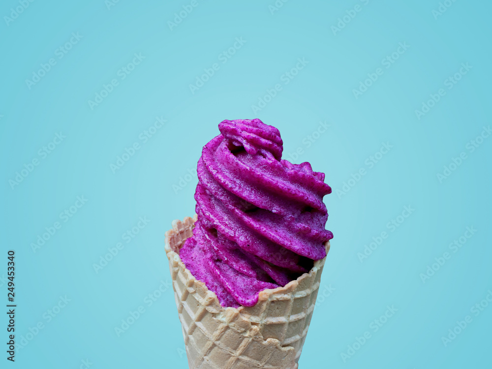 Violet ice cream cone isolated on light blue pastel background. Violet ...