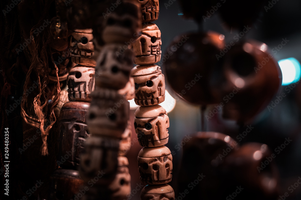 Laughing skull details along with magical shamanic pendants. Mexican ...