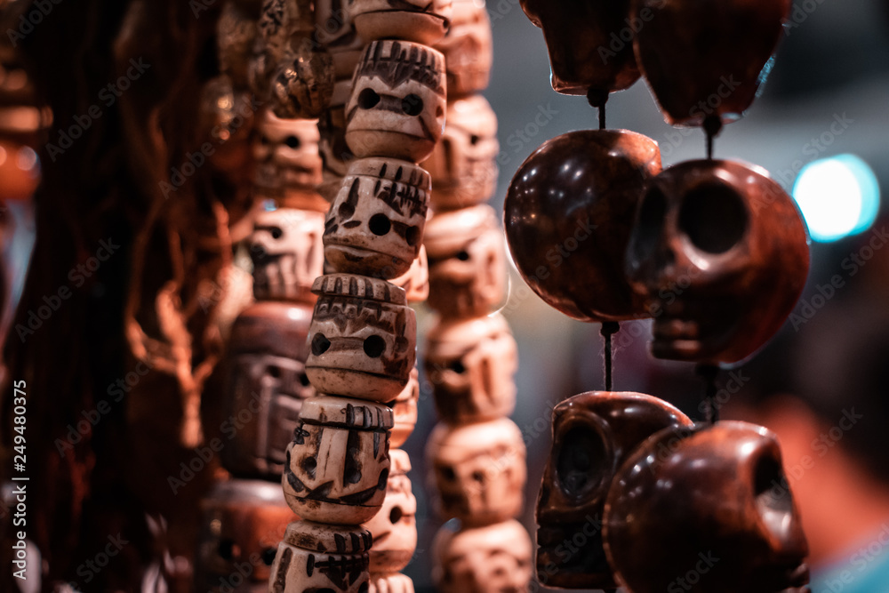 Laughing skull details along with magical shamanic pendants. Mexican ...