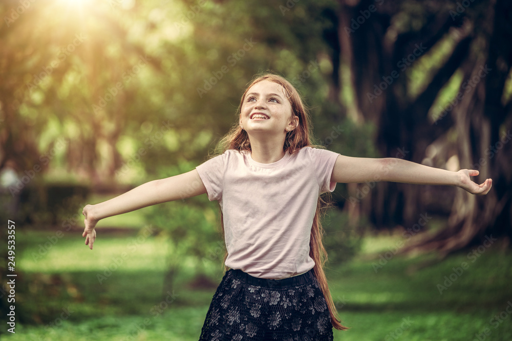 Happy cute little girl playing in the outdoor park in summer. Child ...