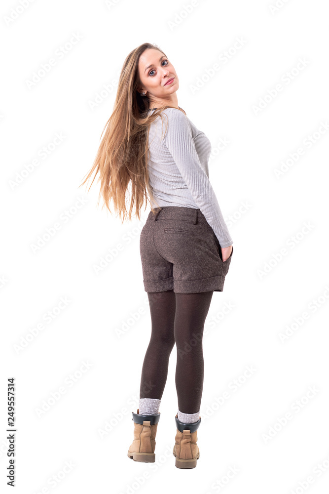 Back view of playful young happy hipster girl with long blonde hair ...