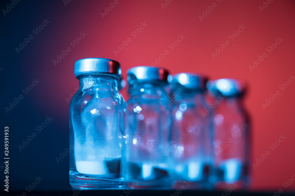 Bottles for injection with white powder on a color background Stock ...