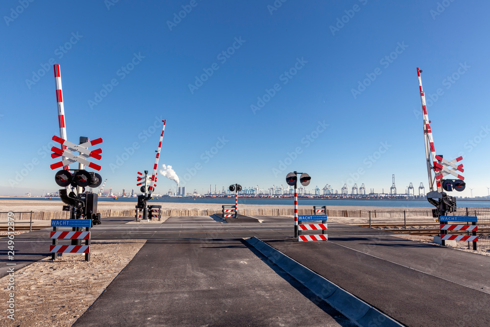 Road signs at the railway crossing with a barrier. Organization of the ...