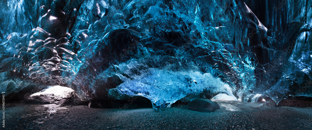 Blue crystal ice cave and an underground river beneath the glacier ...