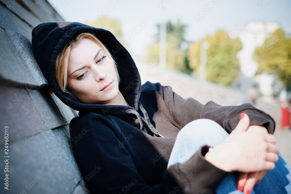 Sad young girl face expression outdoor in urban context Stock Photo ...