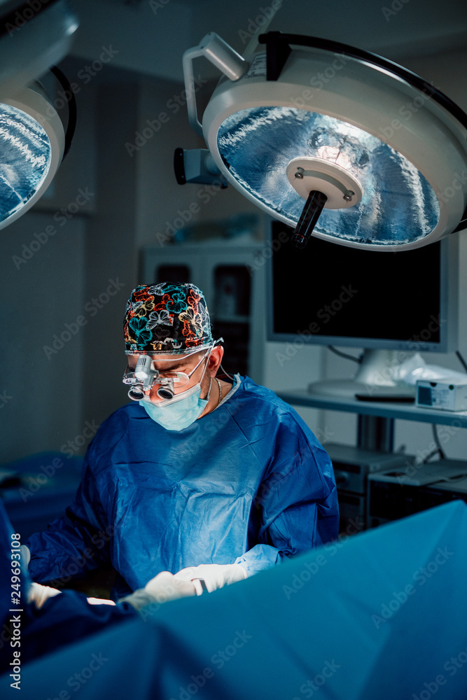 Surgeon Doctor performing operation in hospital environment Stock Photo ...