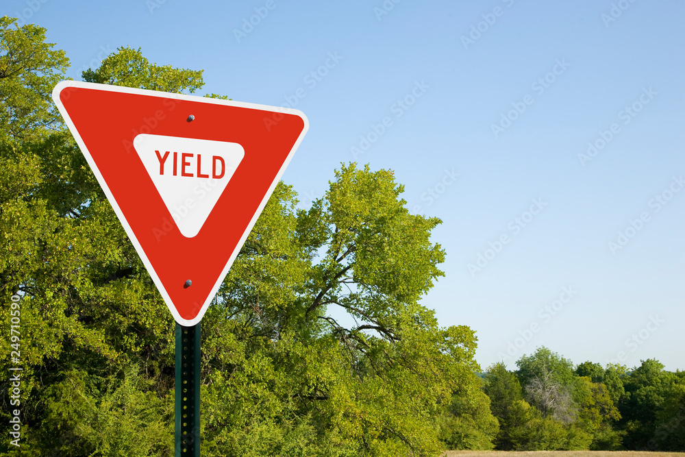 Yield Sign With Green Trees Stock Photo | Adobe Stock