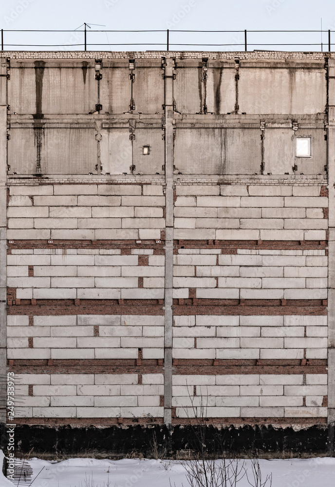 The wall of an old industrial building. Industrial background. A wall ...