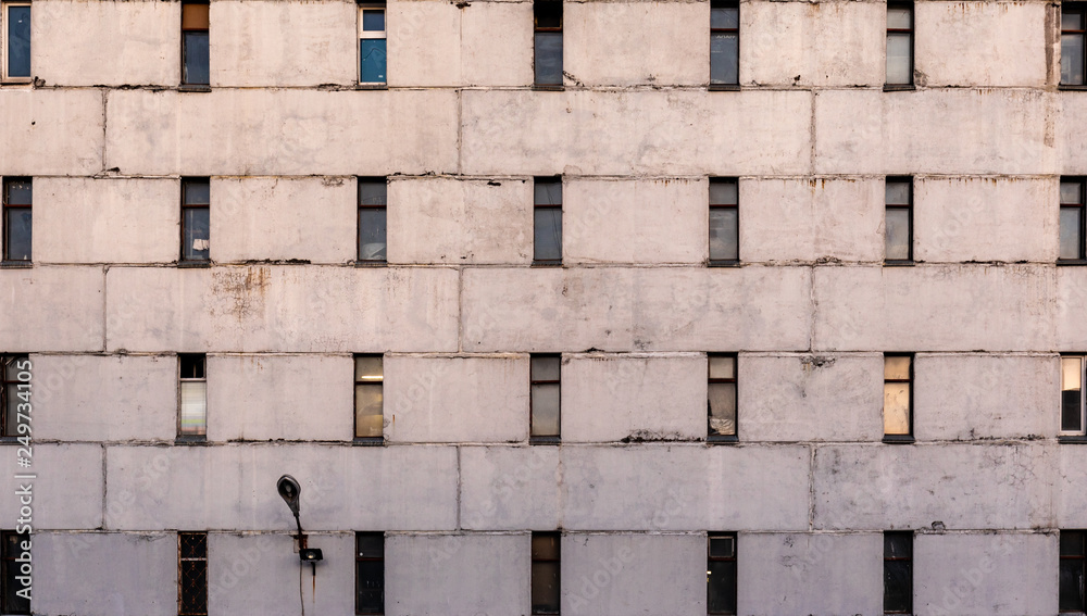 The wall of an old industrial building. Industrial background. A wall ...